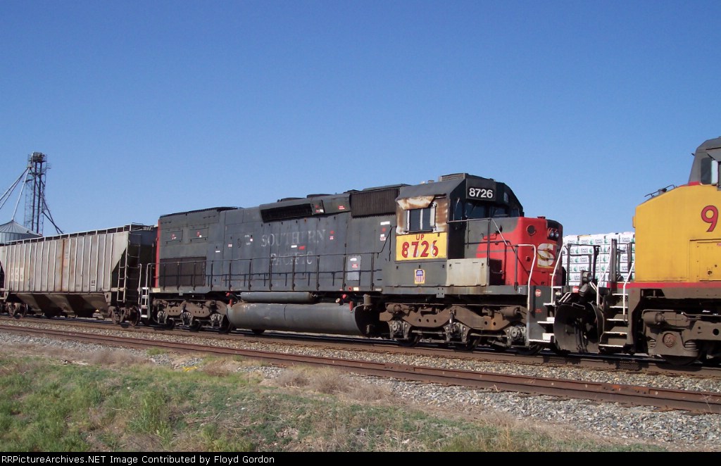UP 8726 westbound on loaded unit grain train.